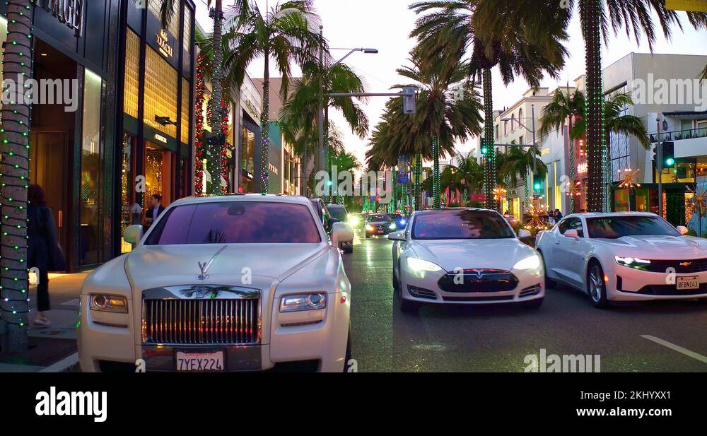 Rolls-Royce luxury cars driving on Rodeo Drive in Beverly Hills, Los ...