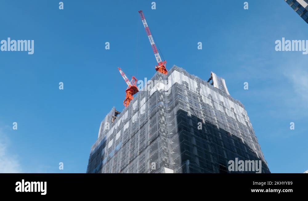 Construction site with crane. Building of a modern skyscraper. 4K time ...