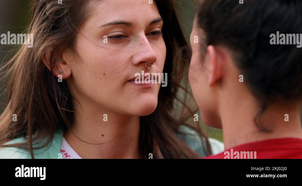 Girlfriends hugging and embracing each other. Two young women hug Stock ...