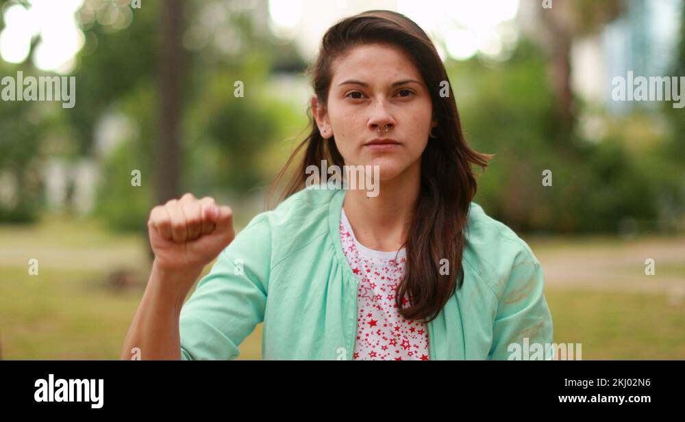 Woman raising hand. Powerful woman lifting fist symbol Stock Video ...