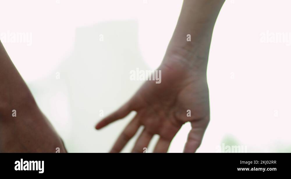 Joining hands together uniting the chain from hands held together in ...