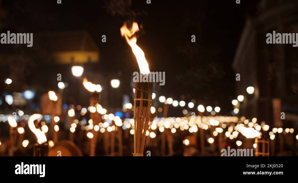 Torchlight procession protest march at night angry people with burning ...