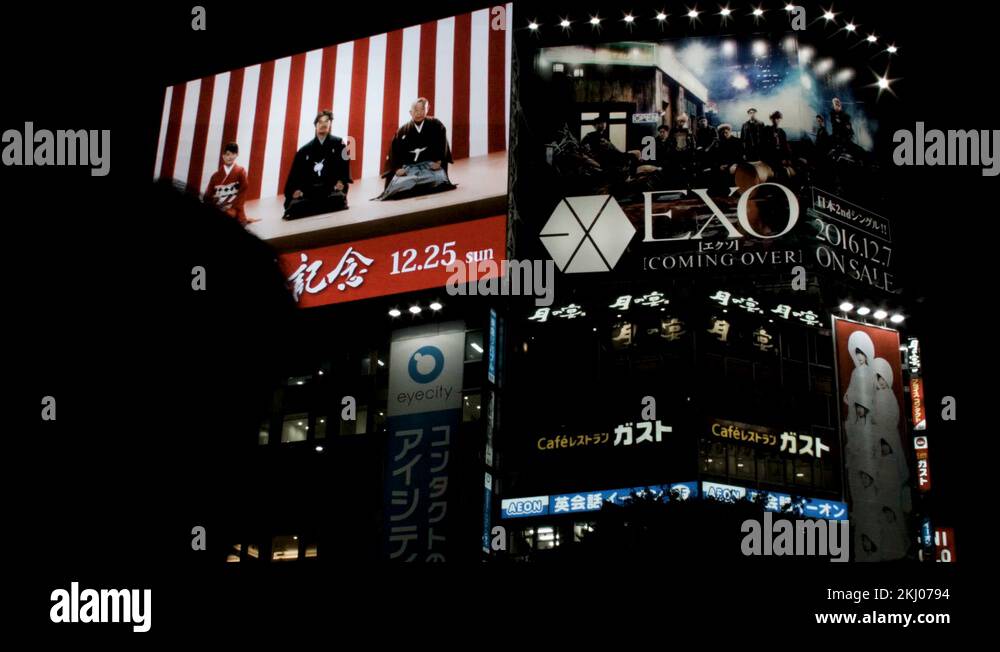 Shibuya Crossing billboards at night including one for the Boy Band EXO ...