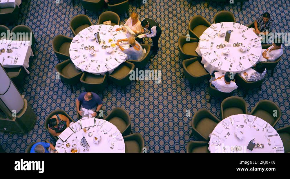 Tourists enjoy food at the restaurant of cruise ship in Labadee, Haiti ...