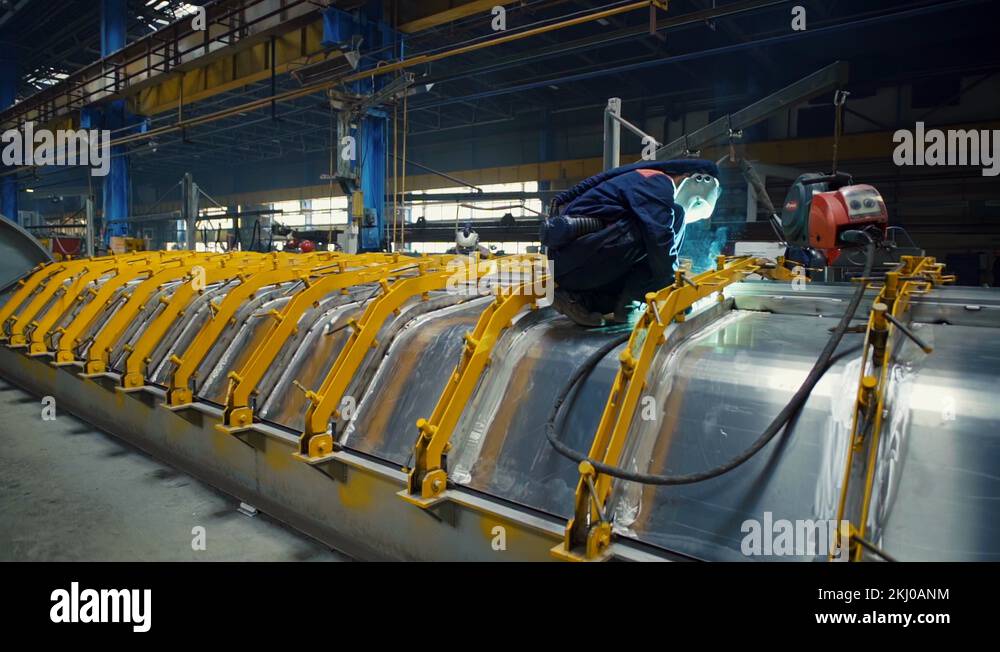 Modern Factory of Rail Car Production Workers Manually Weld the Metal ...