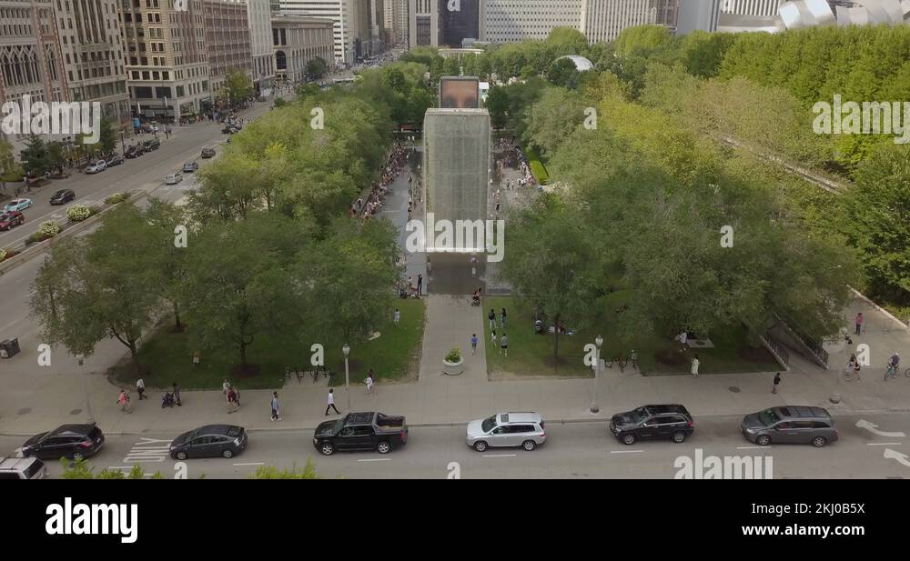 Chicago Aerial - fly toward Crown Fountain in Millennium Park Stock ...