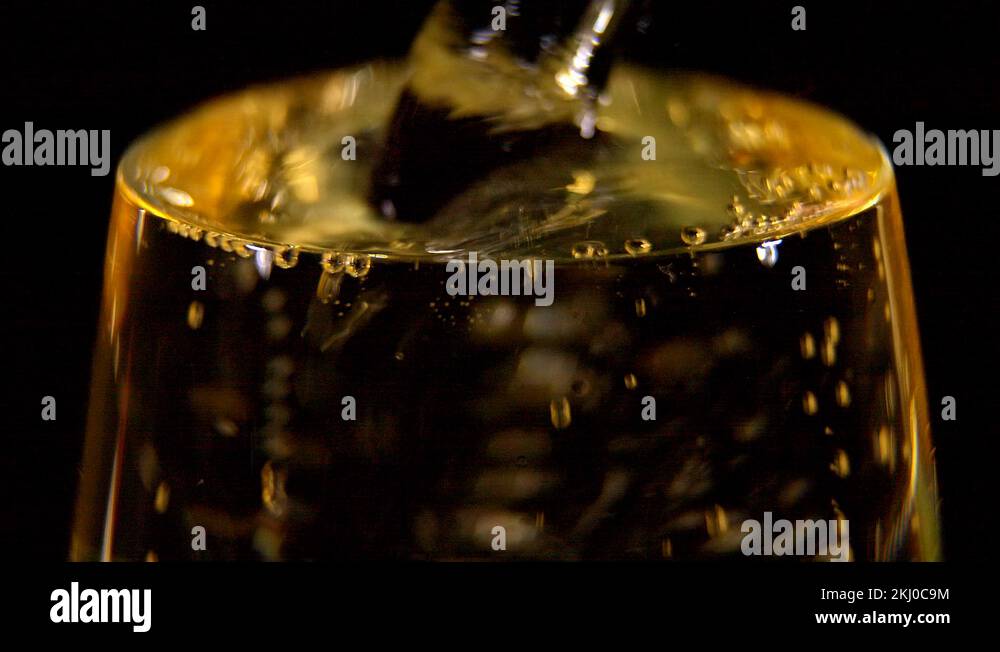 Pouring chamapgne into a glass until overflow - champagne fountain ...