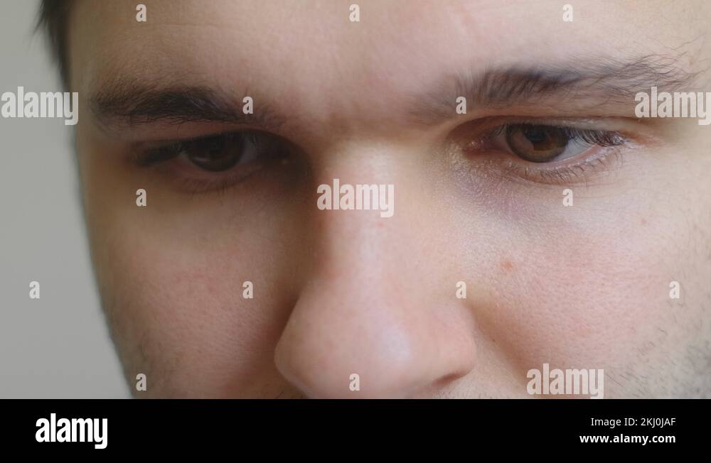 Determination in eyes. Half male face close-up. Human eye looking at ...