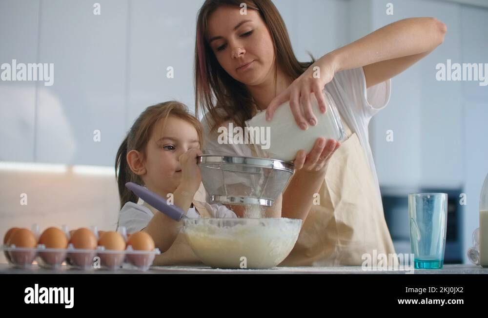 Sift the flour. Family small business mother, a pastry chef, a baker ...