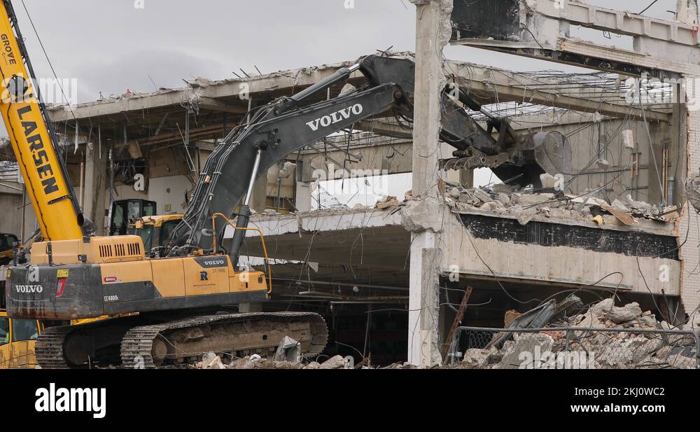 Demolition of concrete building heavy duty Excavator 4K Stock Video ...
