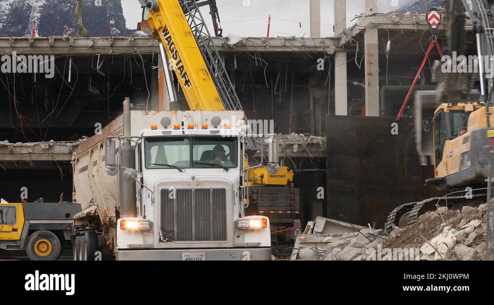 Excavator heavy demolition into truck concrete building 4K Stock Video ...