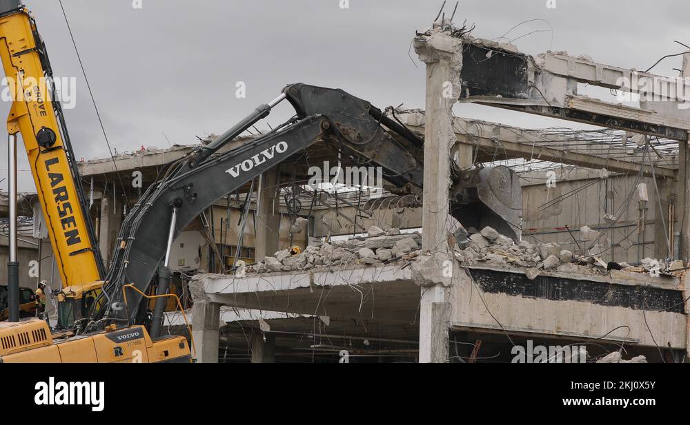 Excavator demolition tearing down concrete building 4K Stock Video ...