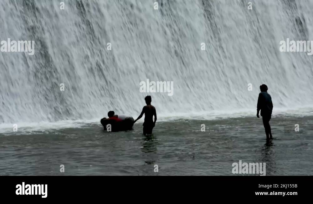 Dam with floodgate, Dam with water overflow, kids playing with water ...