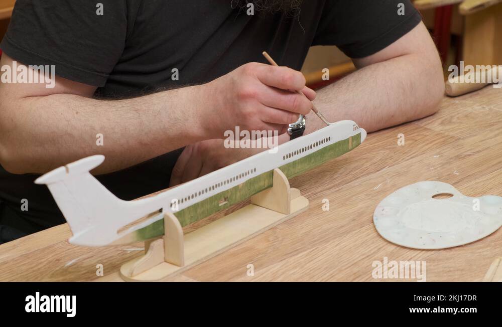 man hand colours outdated jetliner model fuselage edge Stock Video ...