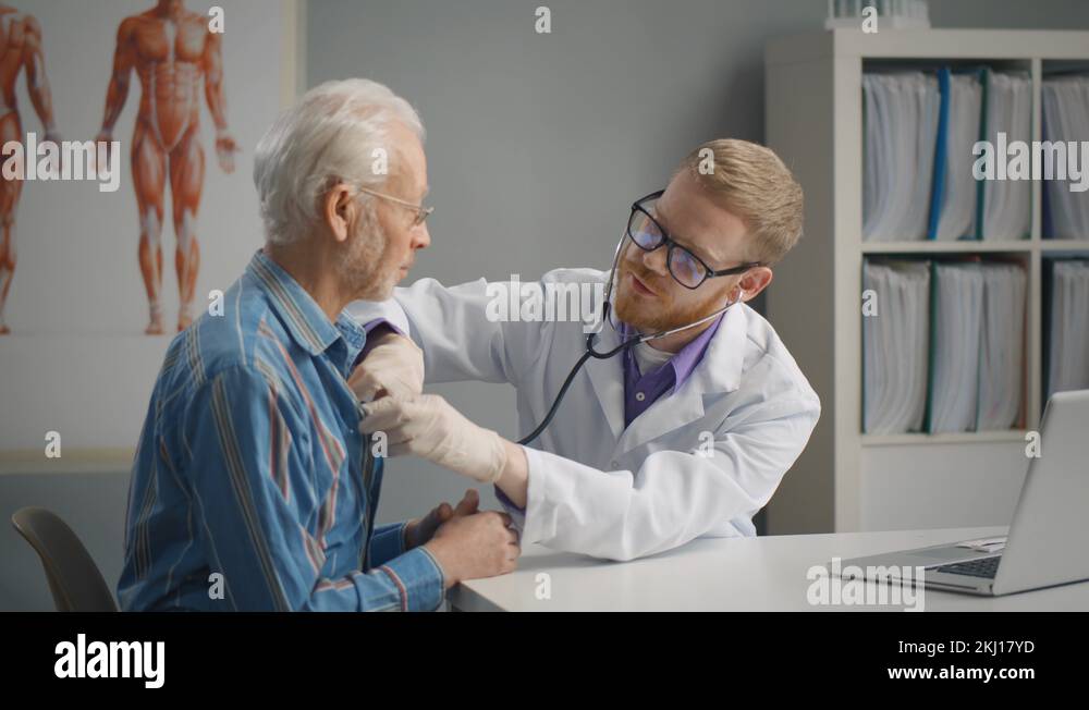 Doctor examining chest of old man with stethoscope Stock Video Footage ...