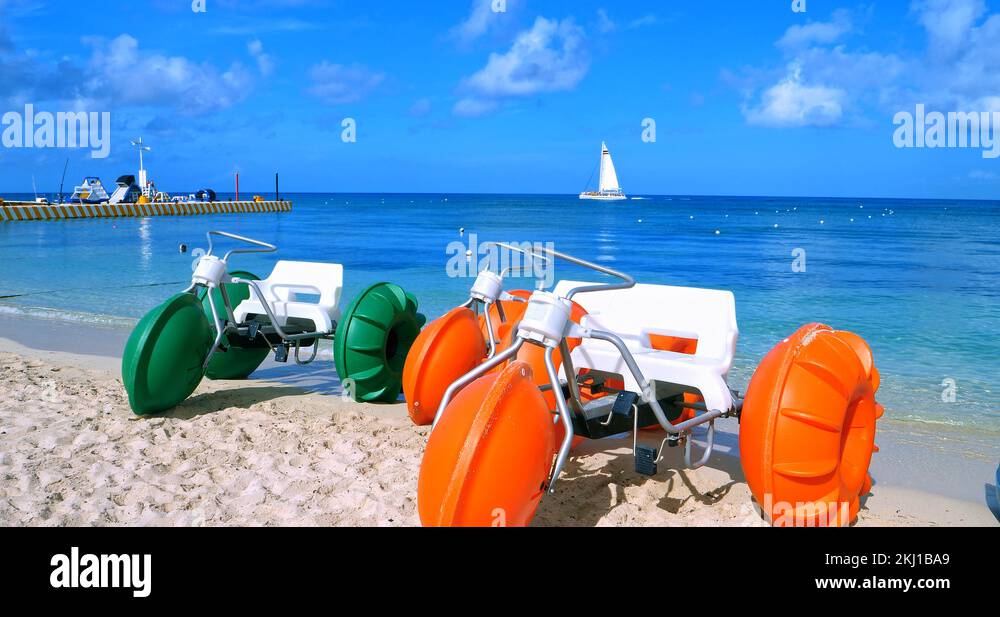 Water bicycles on the tropical Caribbean ocean beach in Cozumel, Mexico ...