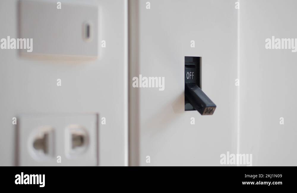 Light is On. Male hand turn on electric breaker switch. 4k Stock Video ...