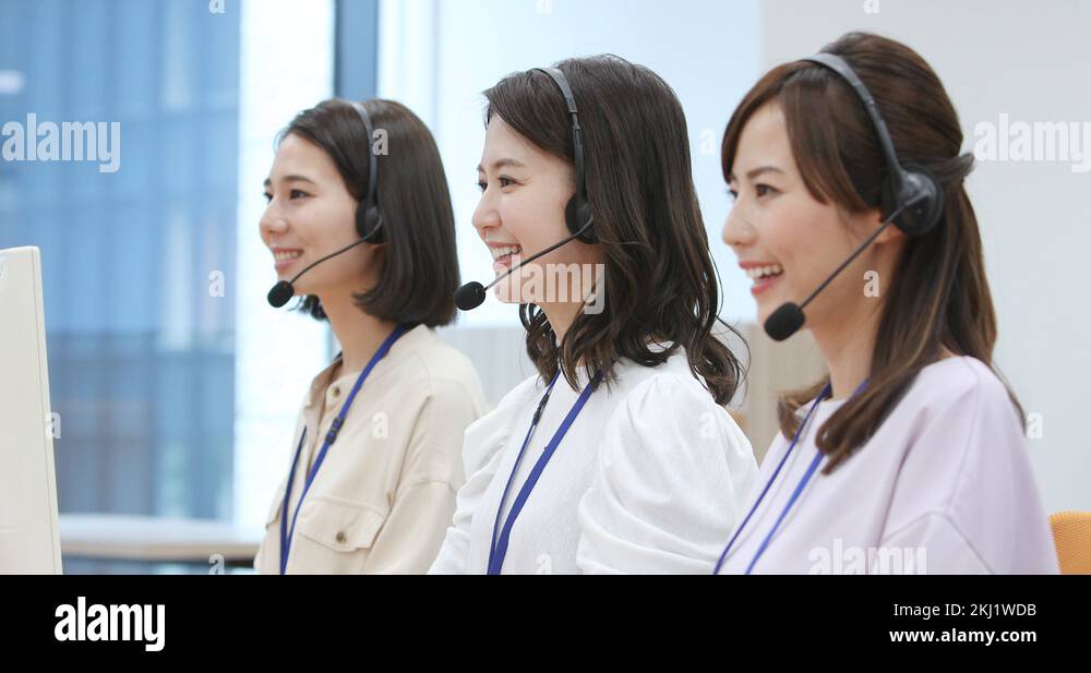 Young Japanese call center operators in the office Stock Video Footage ...