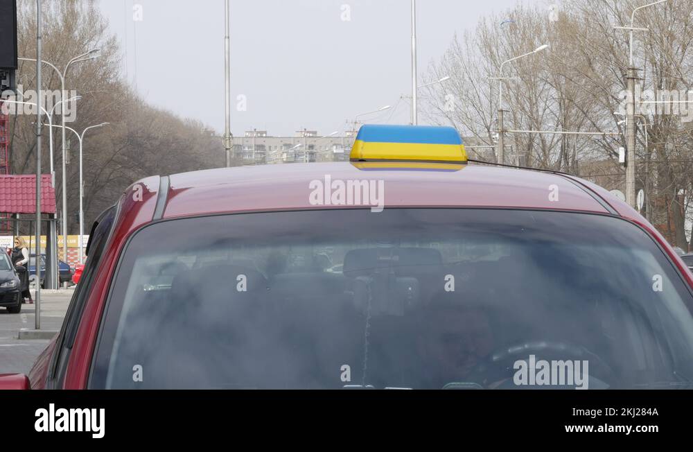 Private taxi car with yellow-blue sign in colors of national flag is ...