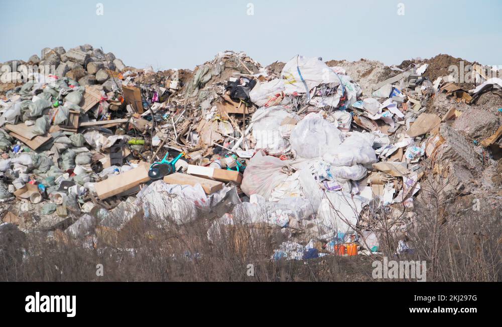 Big piles of garbage Empty bottles, plastic in the waste dump ...