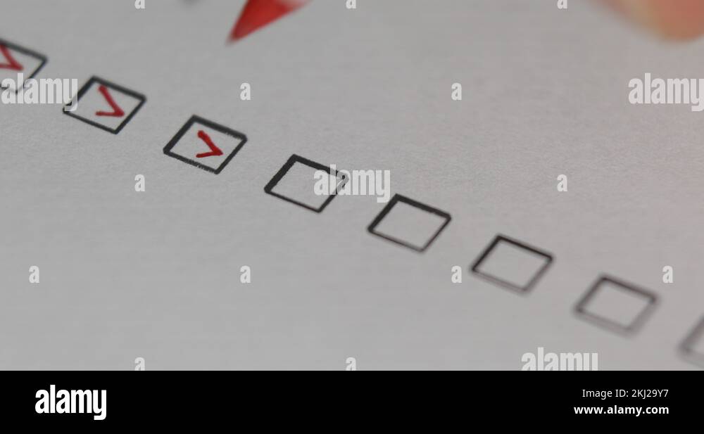 Person Ticks Checkbox Marks with a Pen, filling up To Do List Stock ...