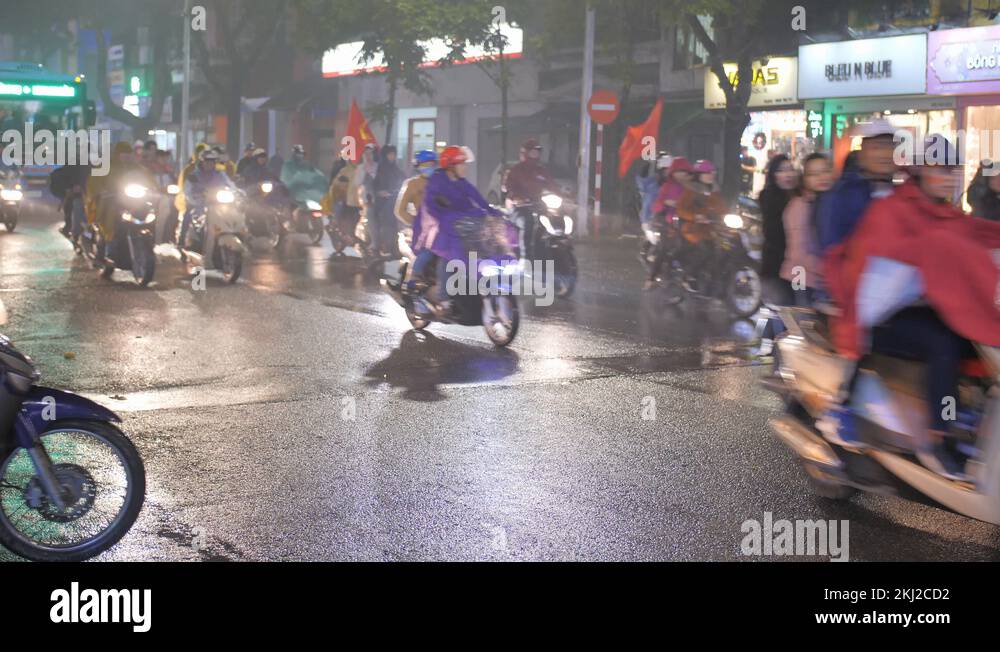 A crowded mess of motorbikes, cars and buses in Hanoi, Vietnam ...