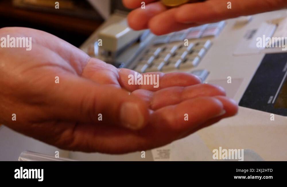 Hands paying coins Stock Videos & Footage - HD and 4K Video Clips - Alamy