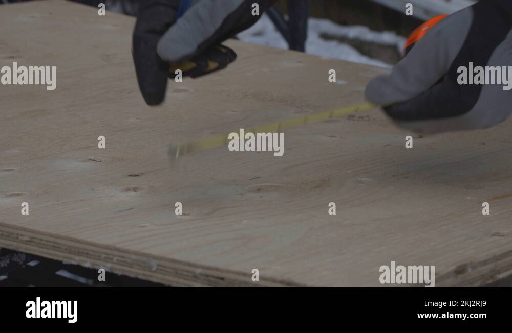 Measuring The Height Of The Wood Plank Using A Tape Measure. -medium ...