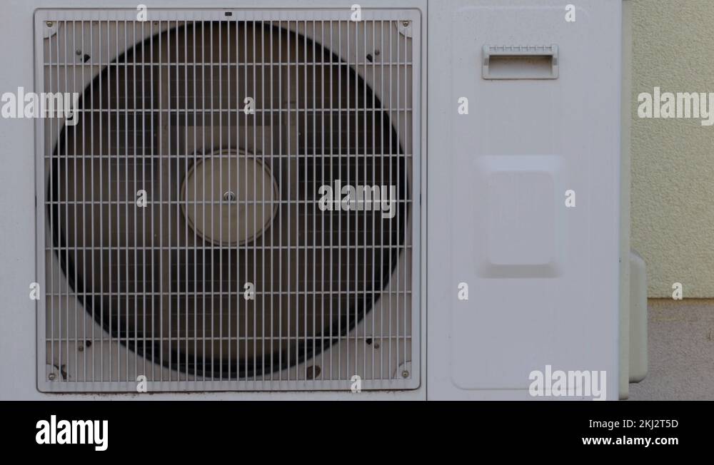 Spinning fan of an outdoor unit of an air conditioning system in the ...