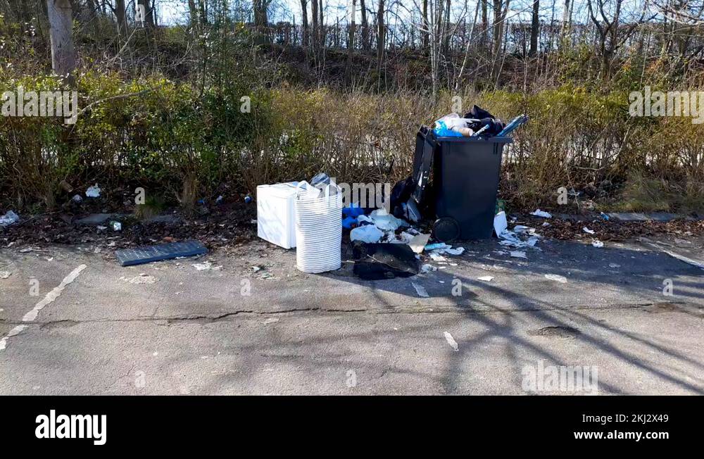 A large plastic trash can, a tank full of garbage and food waste, is ...