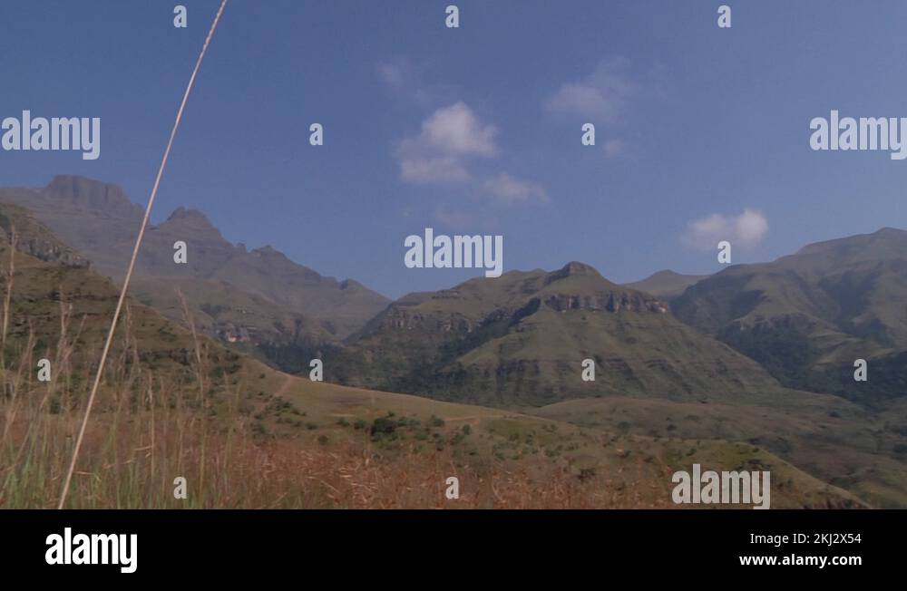 Slow camera pan from left to right showing mountain scenery all around ...