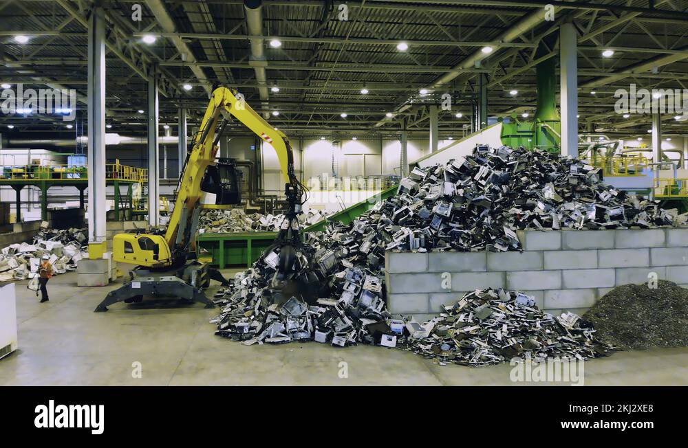 Industrial machine is transporting waste in a landfill unit. Recycling ...