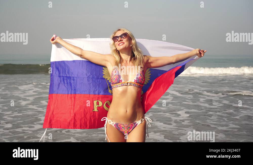 Beautiful Woman In A Swimsuit On The Beach With The Flag Of Russia Stock Video Footage Alamy
