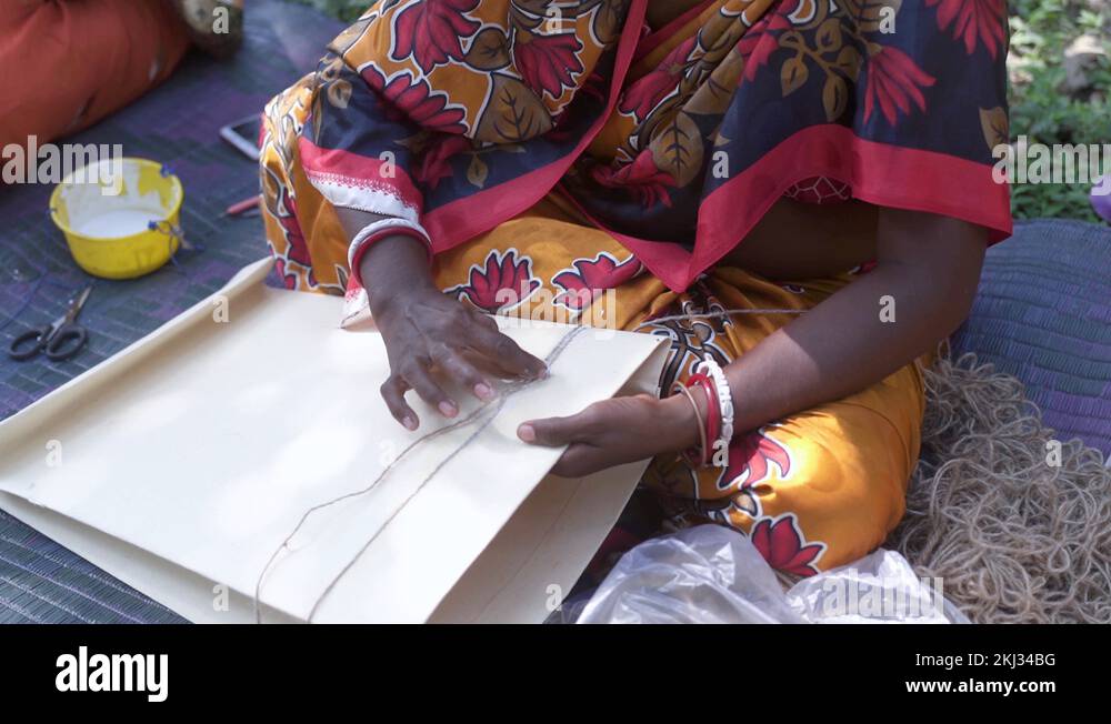 Poor Indian women folding and making bags outdoor Stock Video Footage ...