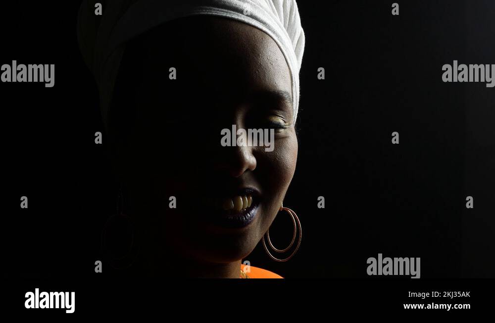 [4k] low key portrait of african german woman wearing ethnic turban ...