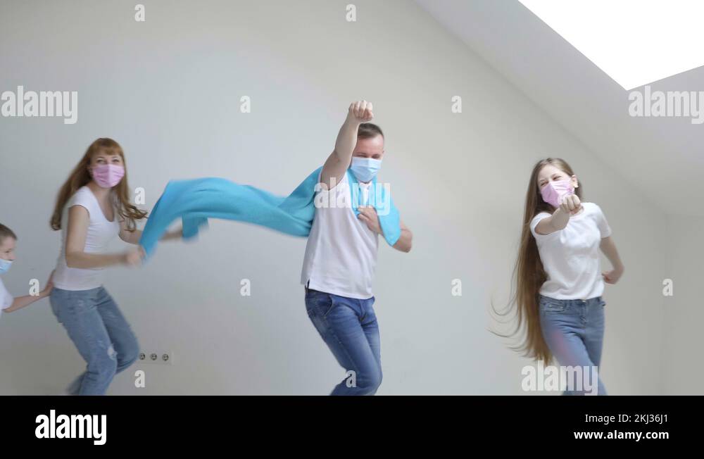 Happy family on white background having fun and wearing mask during ...