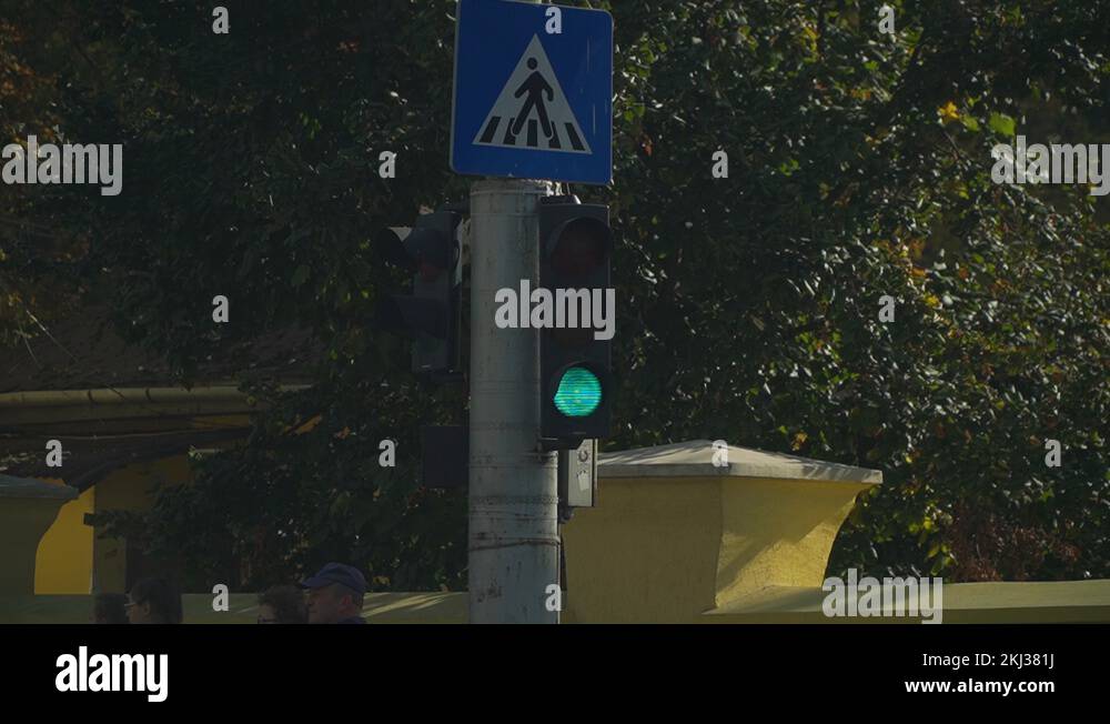 A Sign Board Of Pedestrian Crossing Attached On The Post With The ...