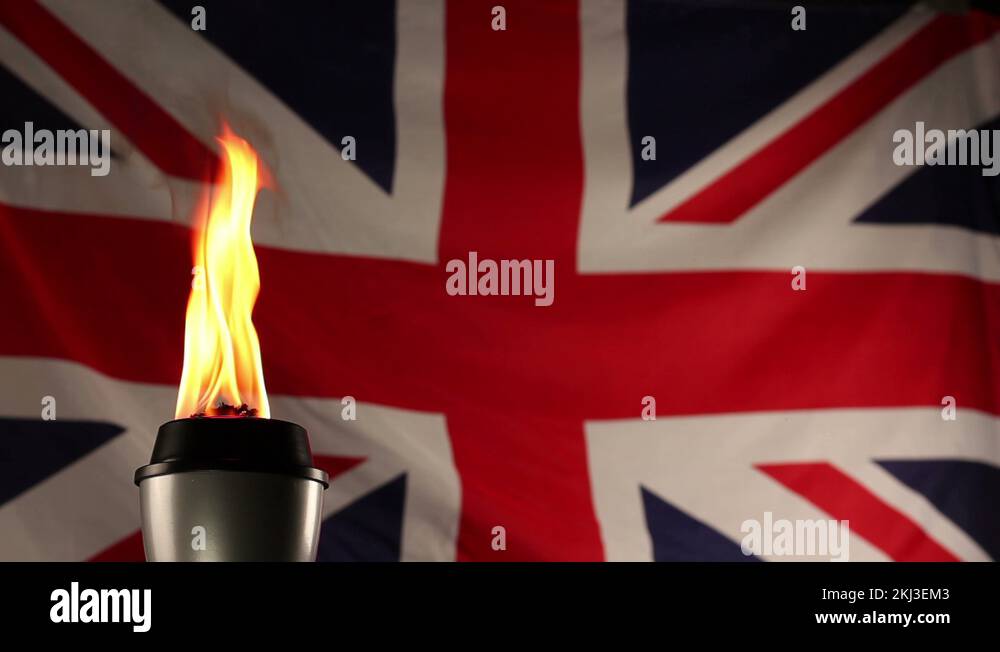 Flaming Torch with the UK Union Flag behind with flames burning ...