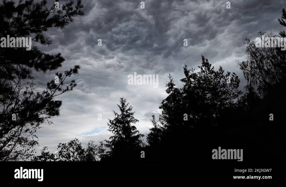 Timelapse zoom in showing scary looking storm clouds rolling over the ...