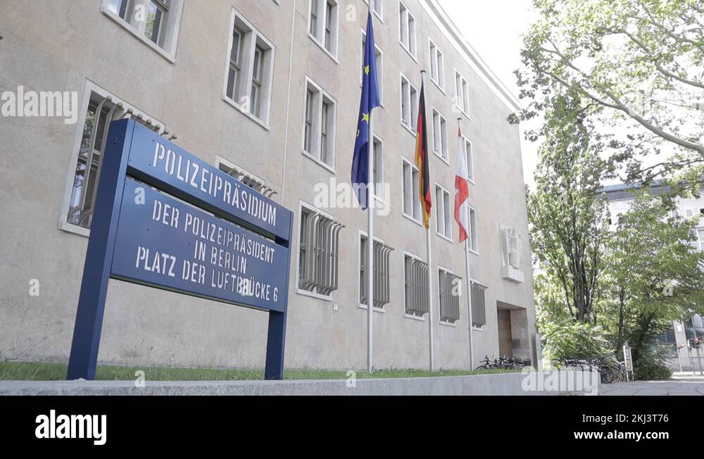 Police station at the german city of Berlin with flags of Germany and ...