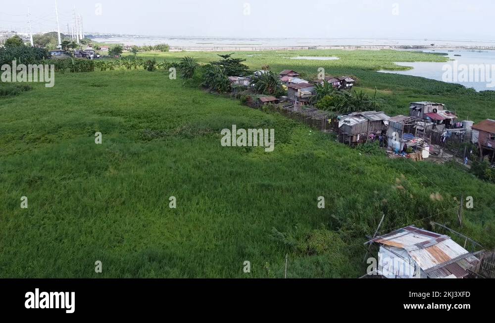 small and poor Philippine village in a swamp in the middle of the ...