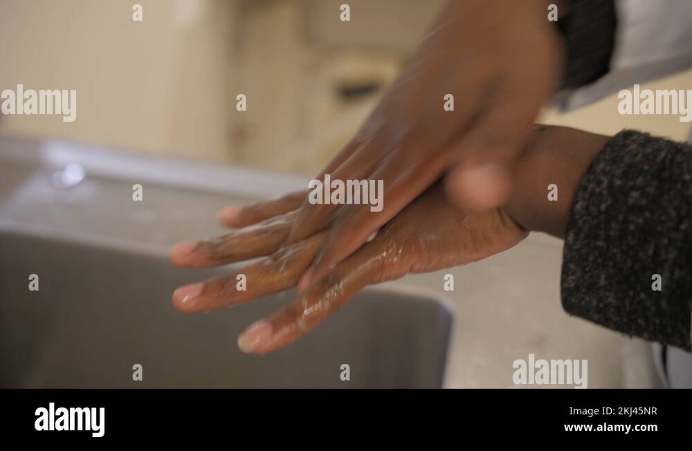 Proper hand washing technique, step 3: Palm to back of hand fingers ...
