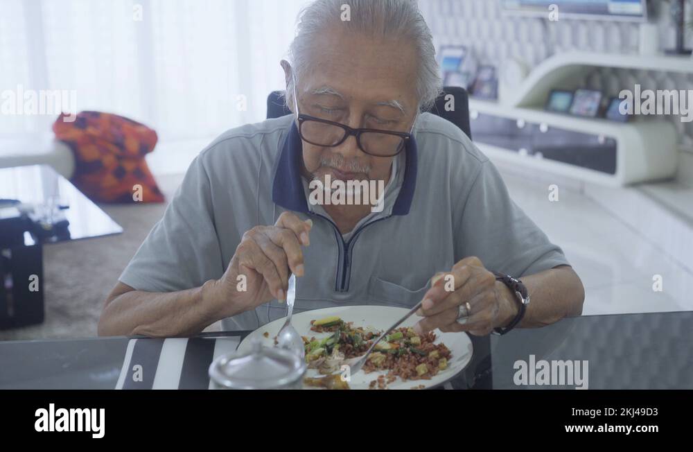 Man sitting alone eating Stock Videos & Footage - HD and 4K Video Clips ...