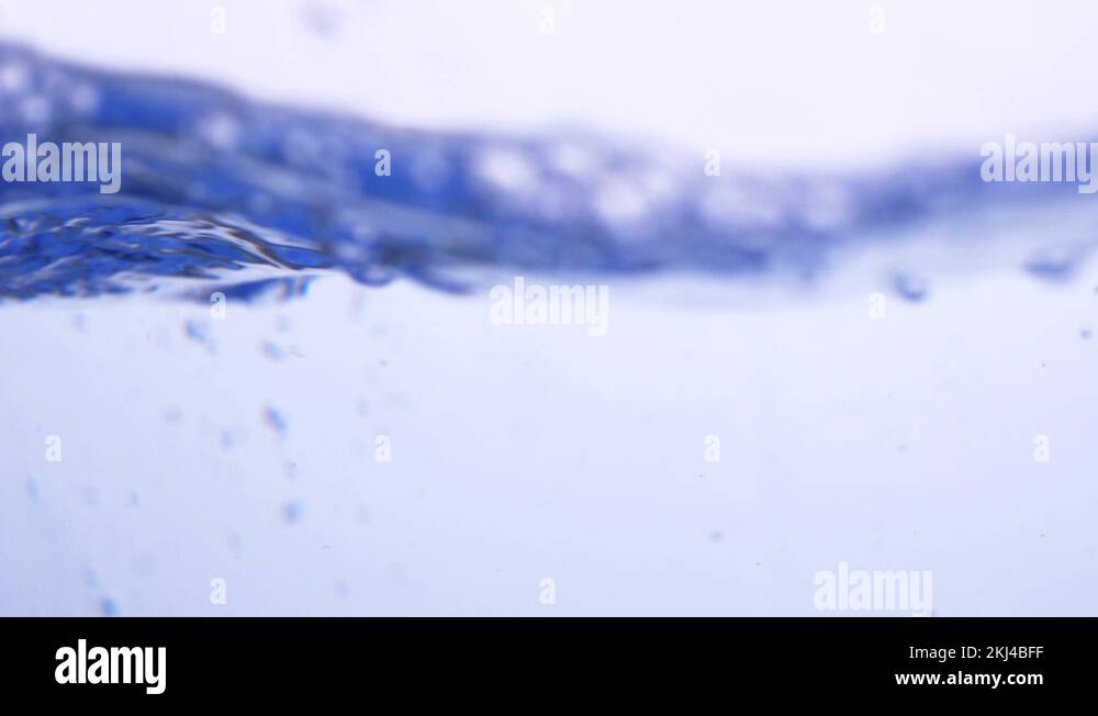 Water splash surface filling the frame with slow motion the water drop ...