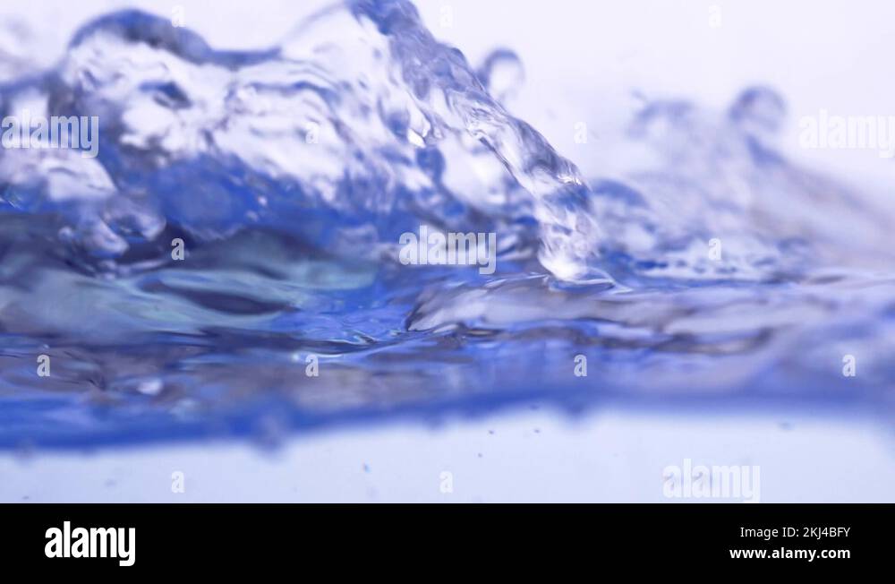 Water splash surface filling the frame with slow motion the water drop ...
