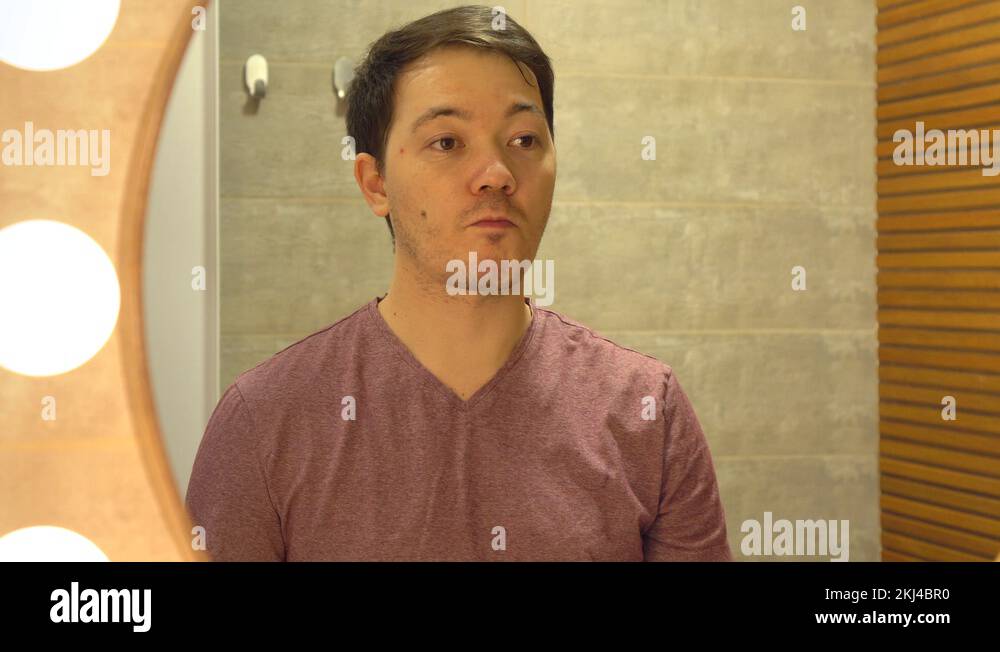 Man rinsing mouth with mouthwash in bathroom. Teeth care Stock Video ...