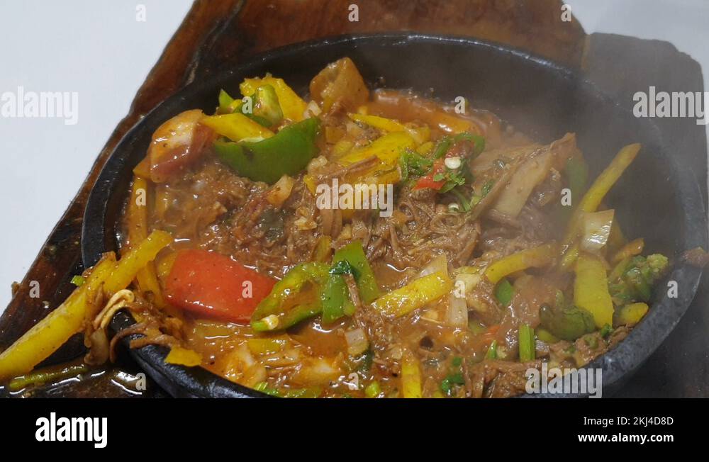 Yemen cuisine sizzling Fahsah lamb and tuna stew Stock Video Footage ...