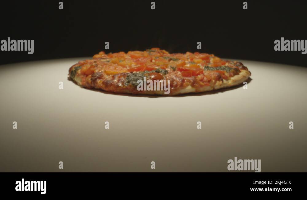 Black background zoom in on fresh pizza Stock Video Footage - Alamy