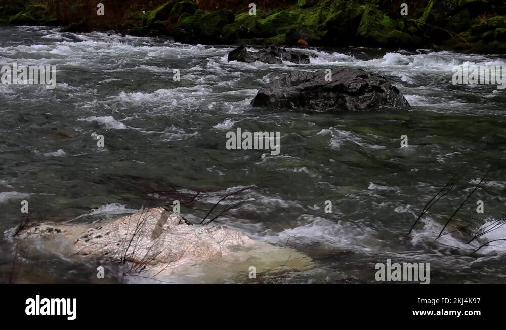 Fast moving wild and scenic river with white granite framing the Stock ...