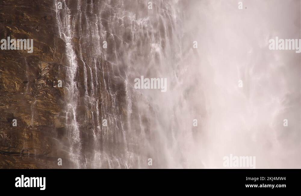 Water dripping of the soaked rock at the base of a waterfall Stock ...
